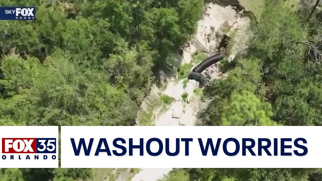 Large washout causes hole near Florida homes - YouTube