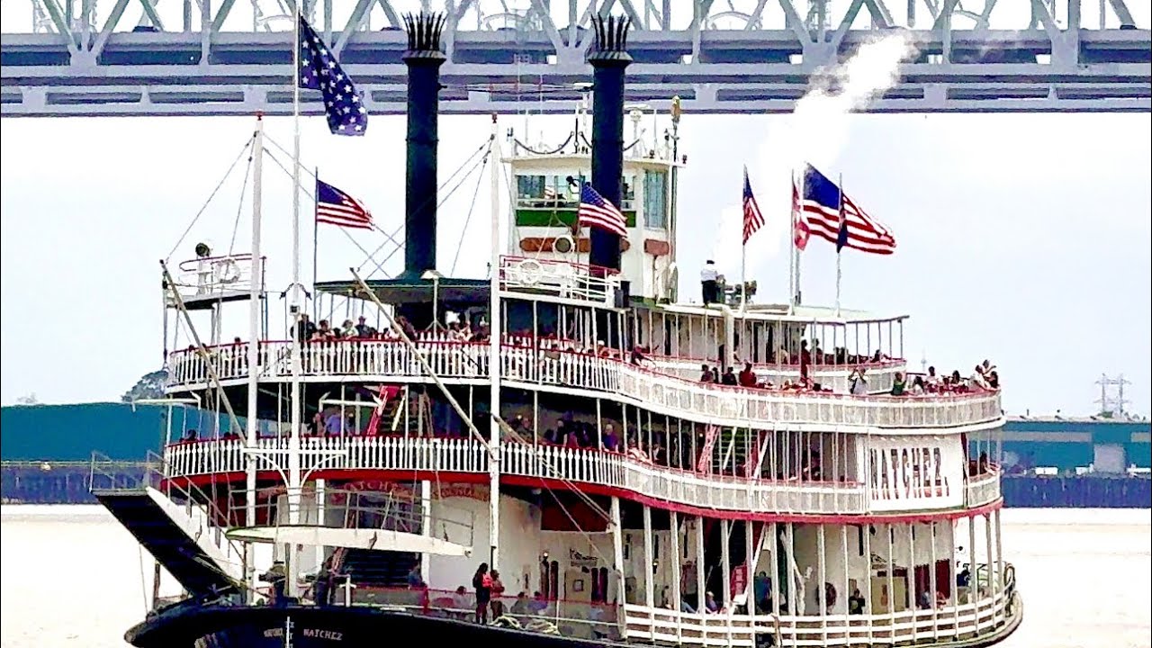 Steamboat Natchez plays organ music and blows horn approaching dock in ...