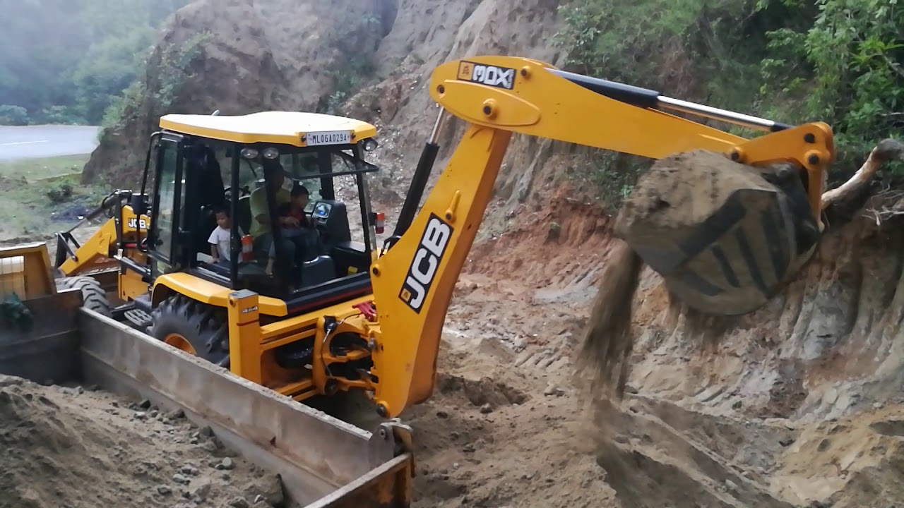little boy operating JCB machine ## little boy driving a jcb backhoe ...