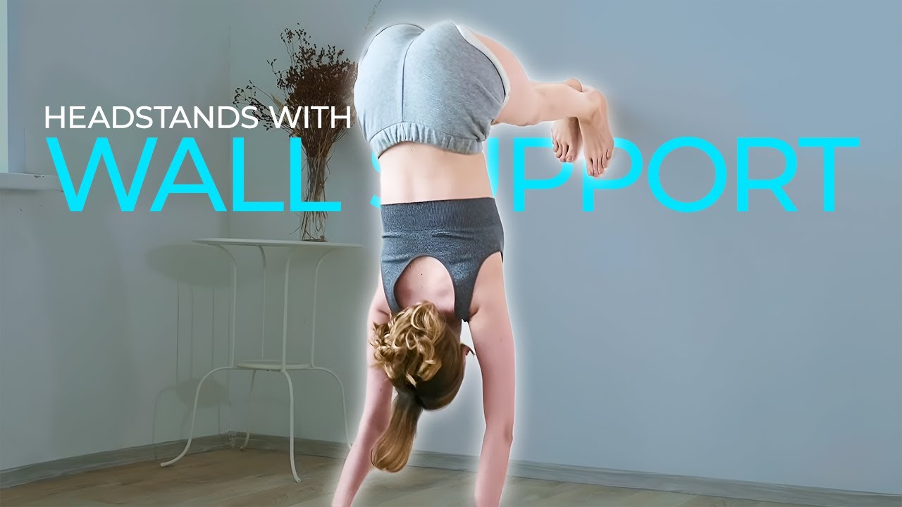 Experience the art of practicing headstands with wall support in ...