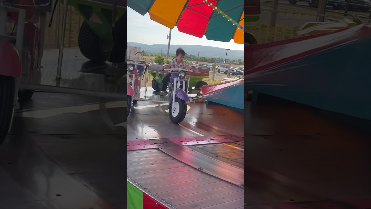 Riding a motorcycle at a carnival - YouTube
