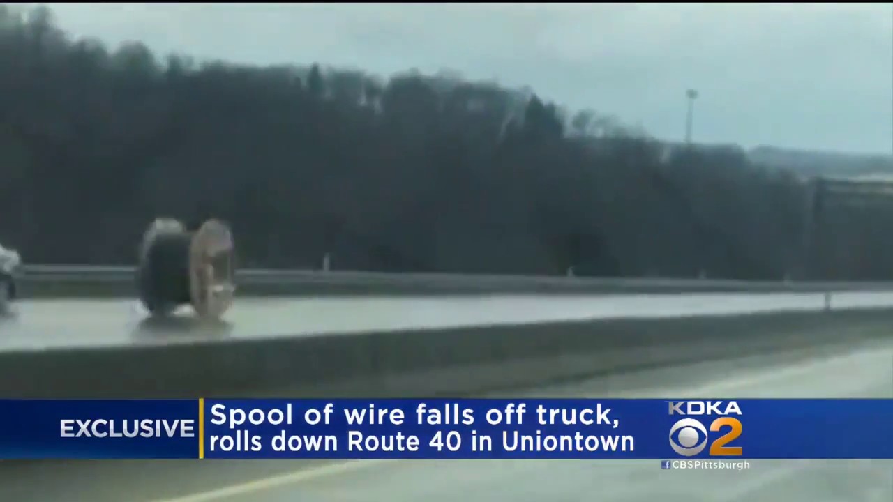 Runaway Giant roll of wire falls from truck, rolls down highway - YouTube