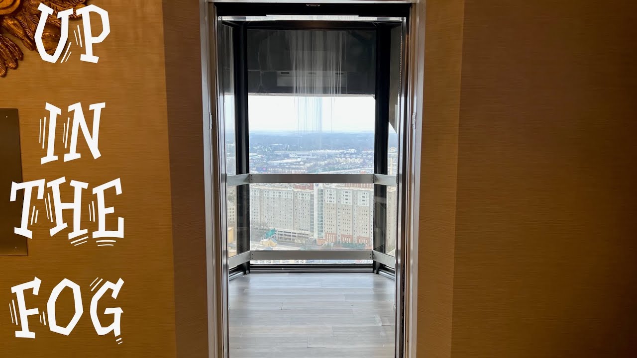 Riding the famous Hilton Atlanta Glass Elevator up into the Fog! - YouTube