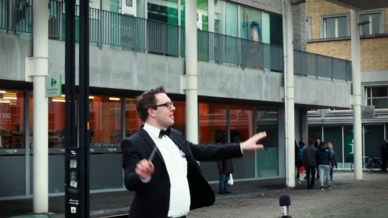 Conductor performs without orchestra? Flashmob PLAY4 2014 VTI Brugge ...