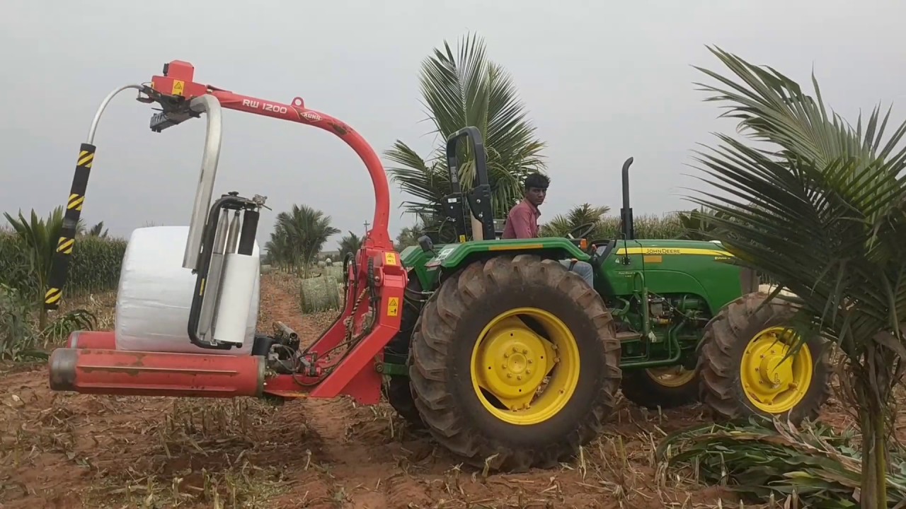 Wrapping Fresh Corn Silage Bales - YouTube