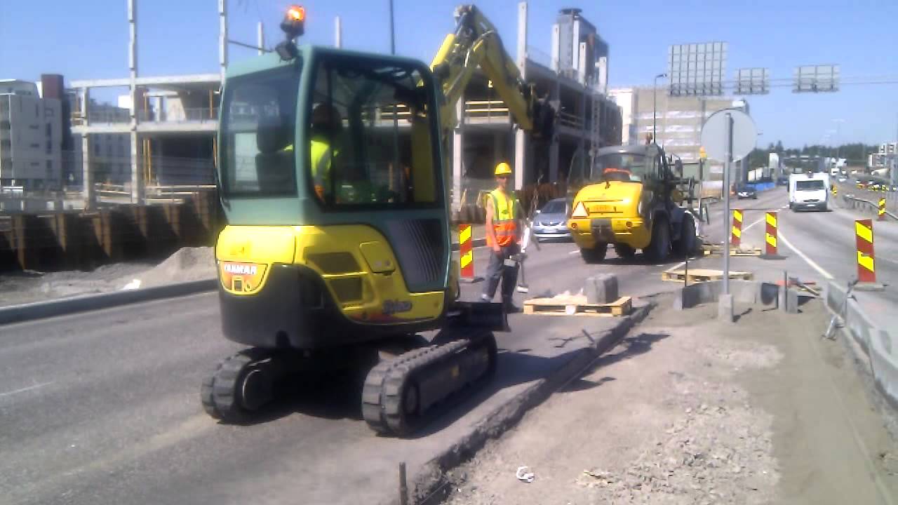Lifting curb stones with yanmar SV-20 and probst lifting tool - YouTube