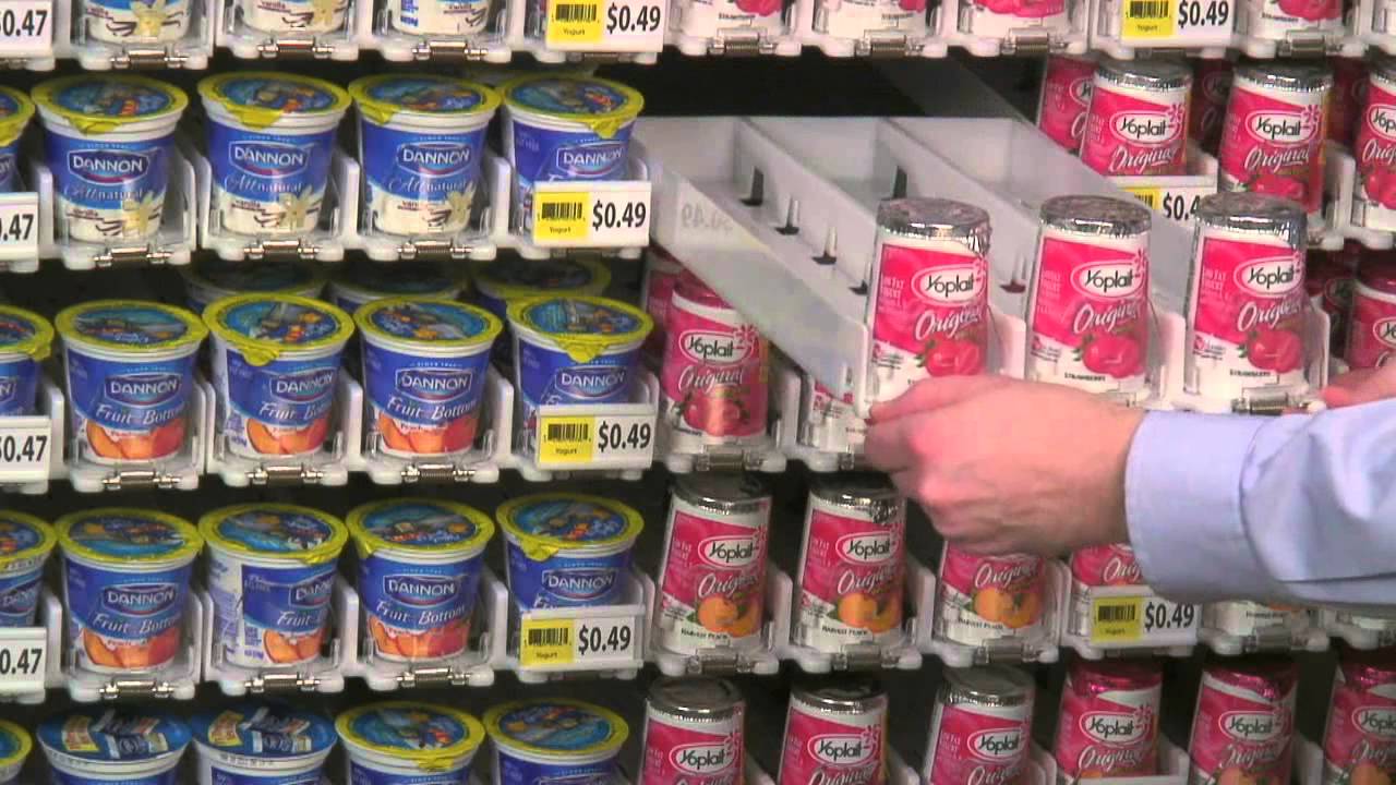 Gravity feed merchandiser for yogurt - YouTube
