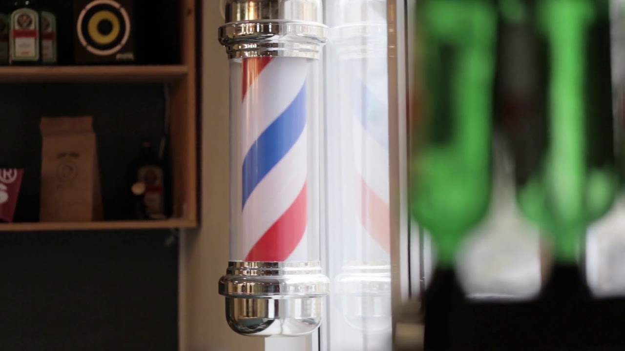 barber pole spinning at a barbershop - YouTube