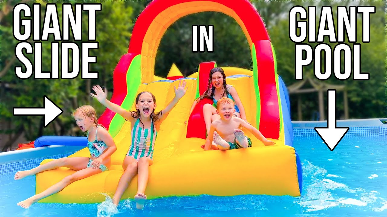 We put a GIANT Inflatable SLIDE in our SWIMMING POOL! - YouTube