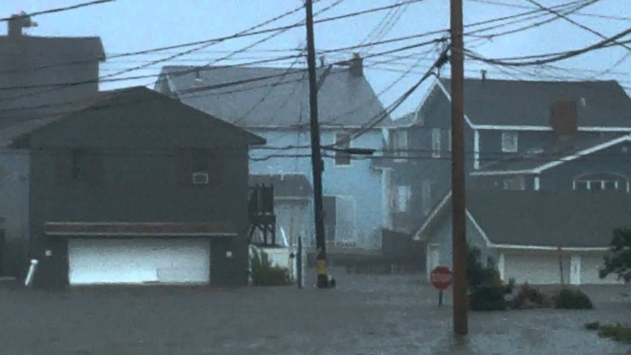 Waves crash over house during hurricane - YouTube