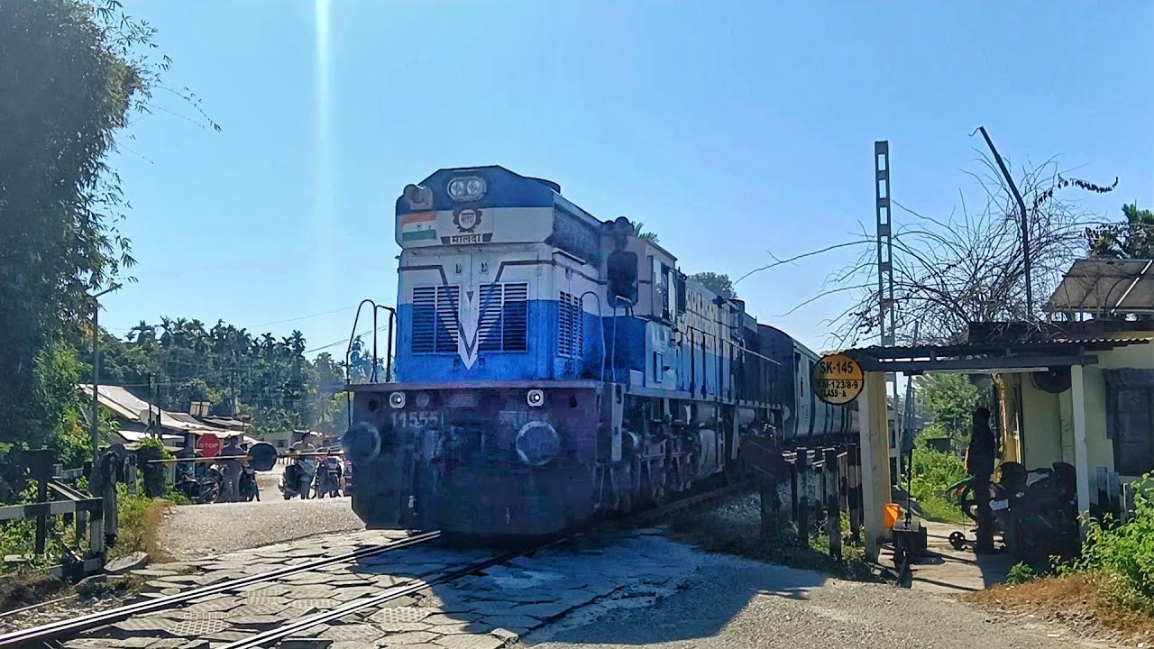 Train passing through a railroad crossing | Siliguri - Bamanhat Express ...