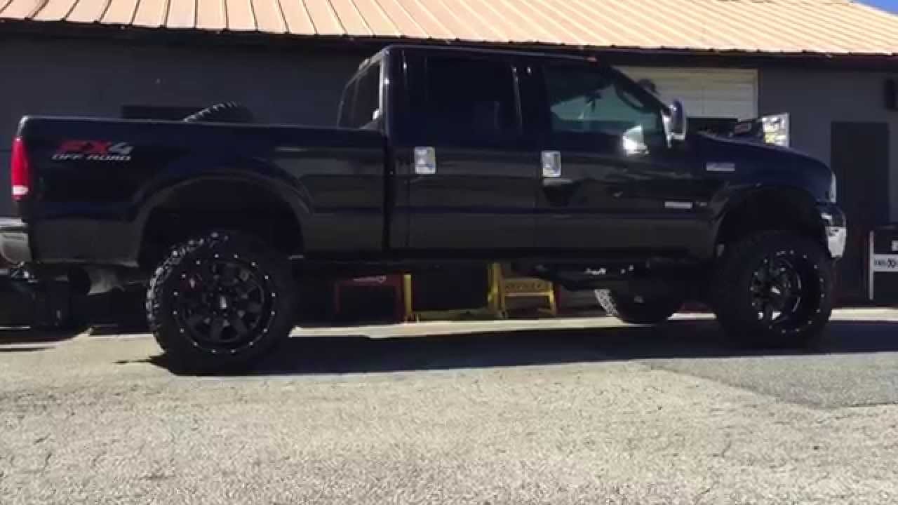 Moto Metal M0962 22"x14" Wheels on Stretched Nitto Tires - Lifted Ford ...