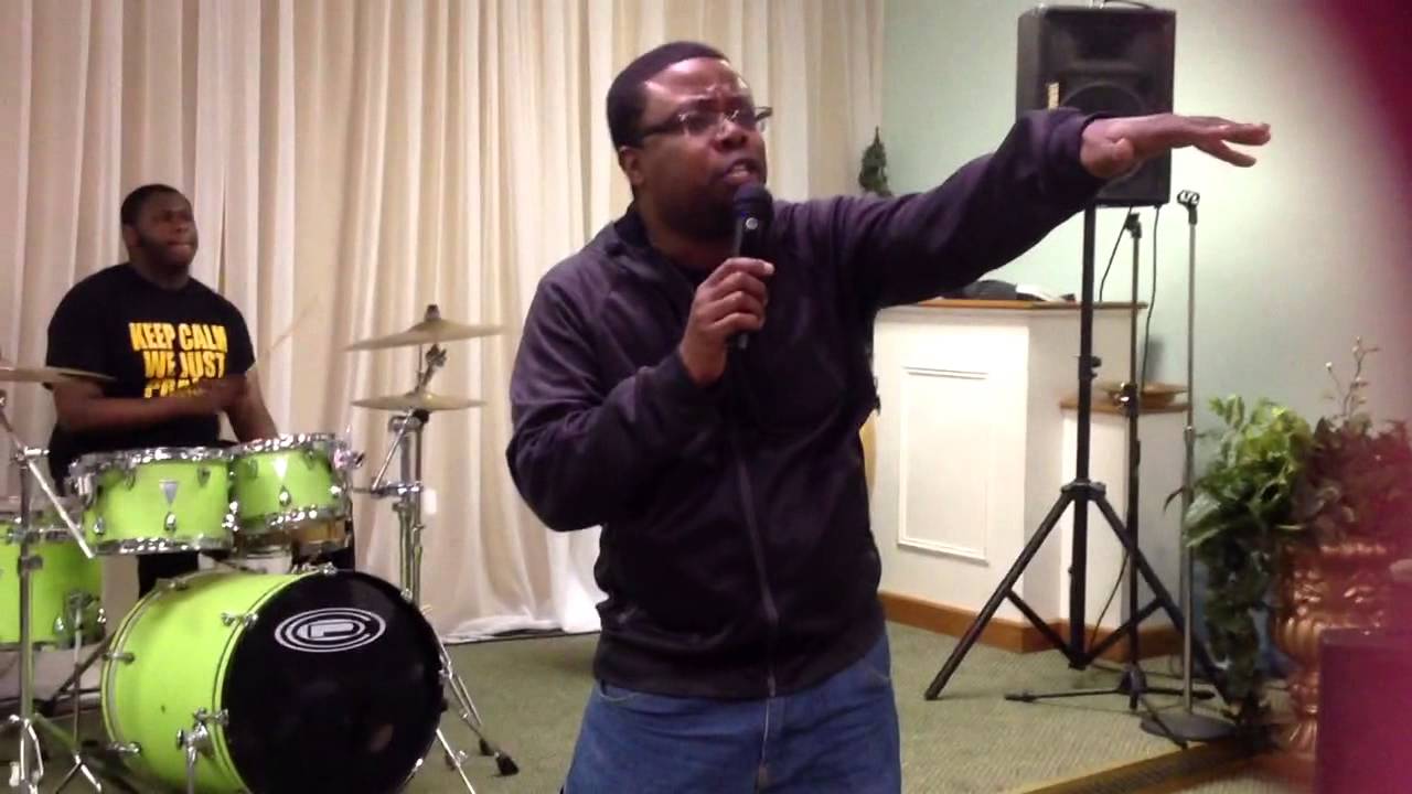 Pastor Carlos Sims singing "Safe in His Arms" at Temple of Judah ...
