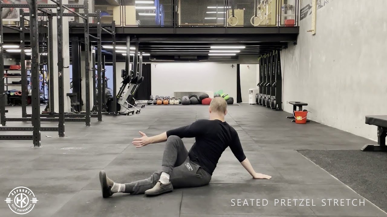 Seated Pretzel Stretch - YouTube