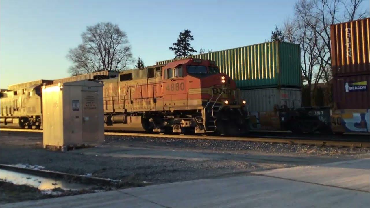 A Race between BNSF 7944 East with a stack train and BNSF 4880 East w/ a z-train Ransom, IL 02 ...