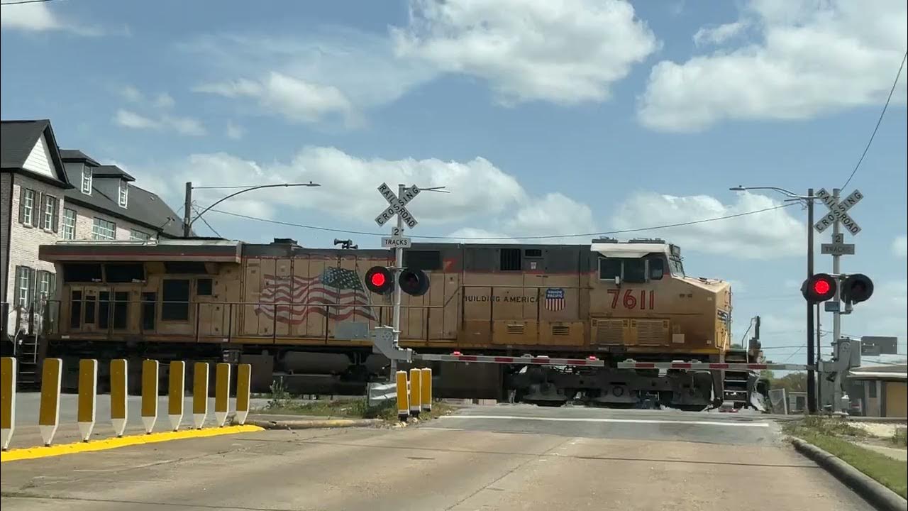 UP 7611 leading a empty sand train - YouTube