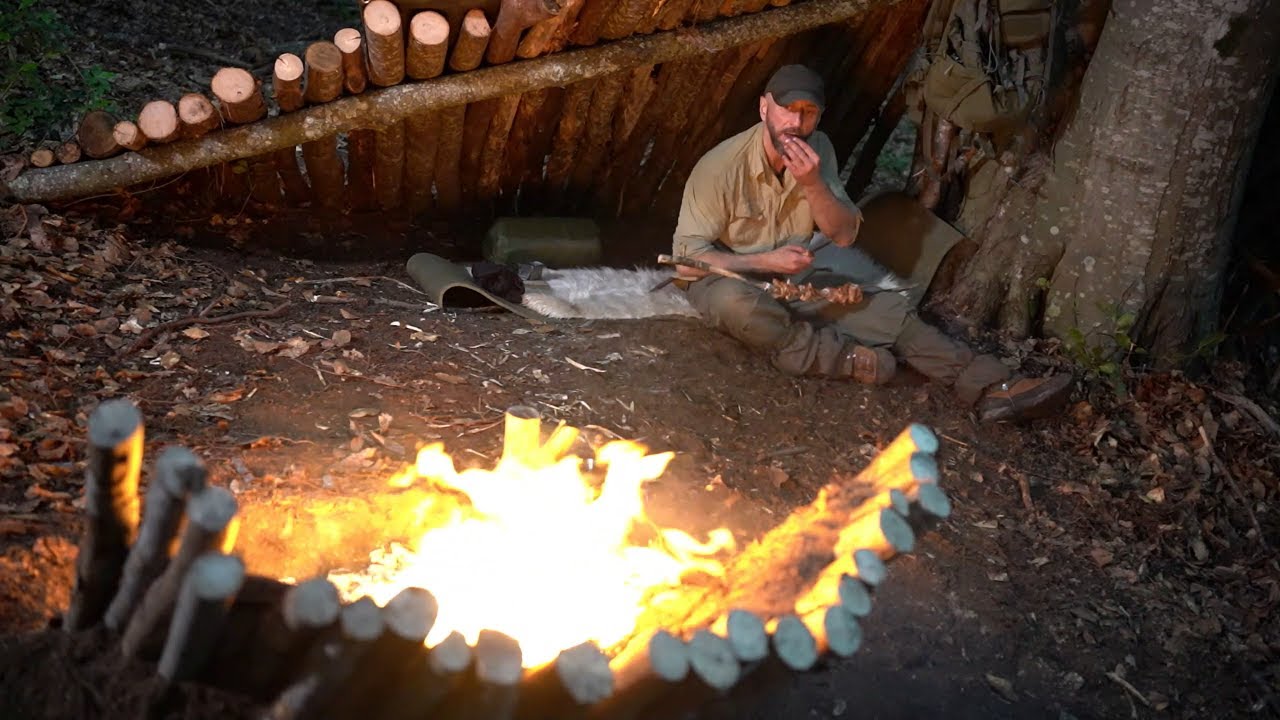 Overnight in the wilderness.Shelter building.special fireplace with ...