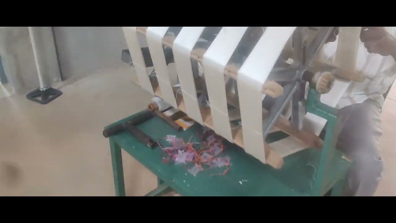 silk yarn being stitched with cotton thread to make it easy for ...