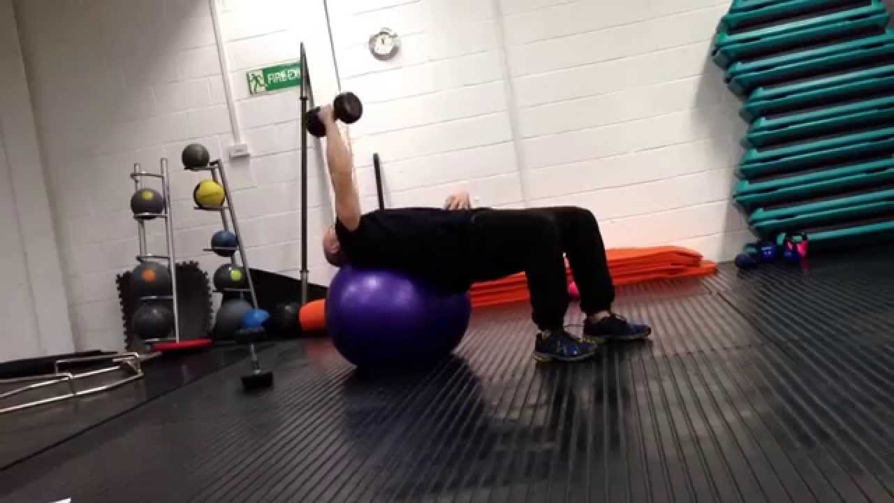 One arm dumbbell chest flye supine on fitball - YouTube