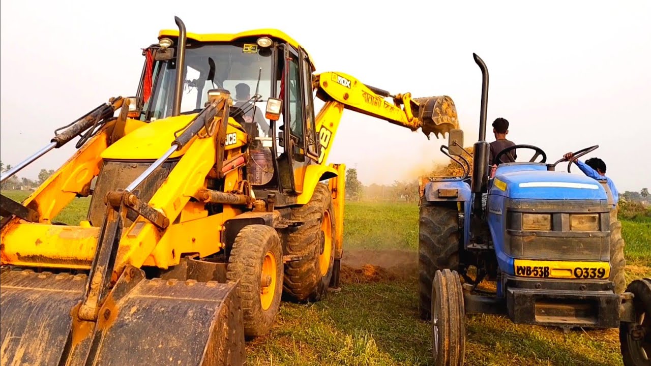 New Jcb 3dx Backhoe Machine Loading Mud In Old Sonalika Di 35 RX ...