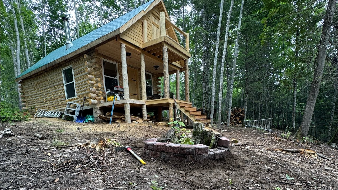 Building an off grid log cabin at the river, building a campfire pit ...