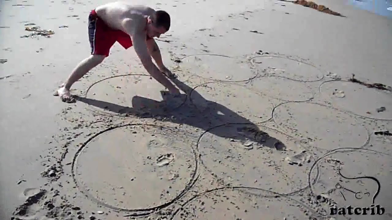 drawing perfect circles on San Diego beach sand - YouTube