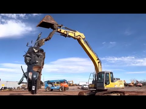 Destroying a Ford Mini Van With Construction Equipment - YouTube