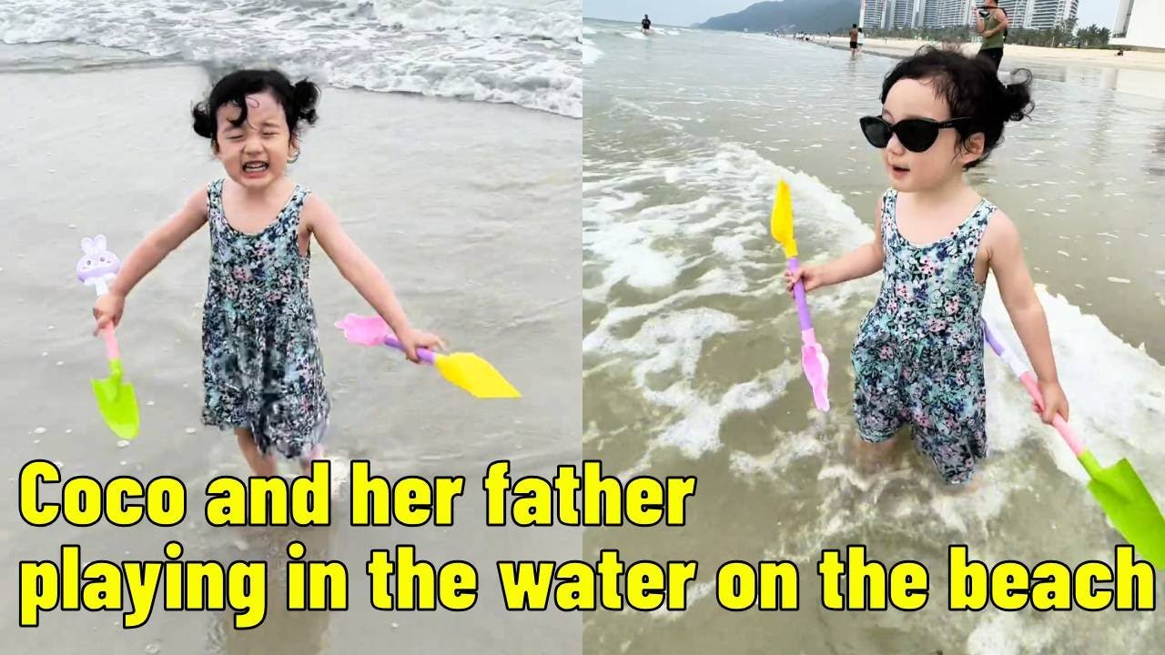 Coco and her father playing in the water on the beach. - YouTube