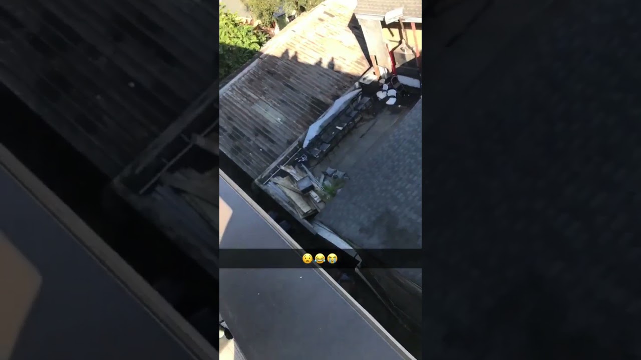 Guy falls while hanging onto building's ledge - YouTube