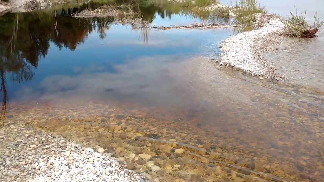 Trout River flowing into Lake Huron in Rogers City, MI - YouTube