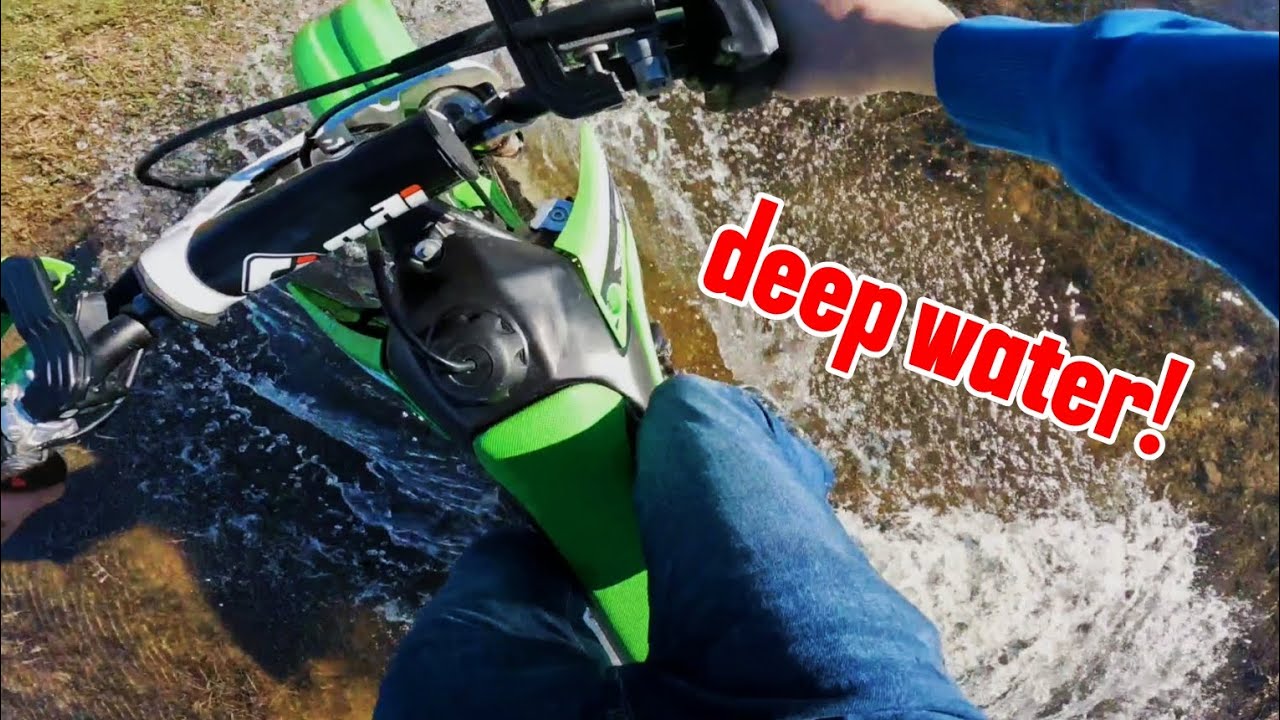 Dirt bike through water and wheelies - YouTube