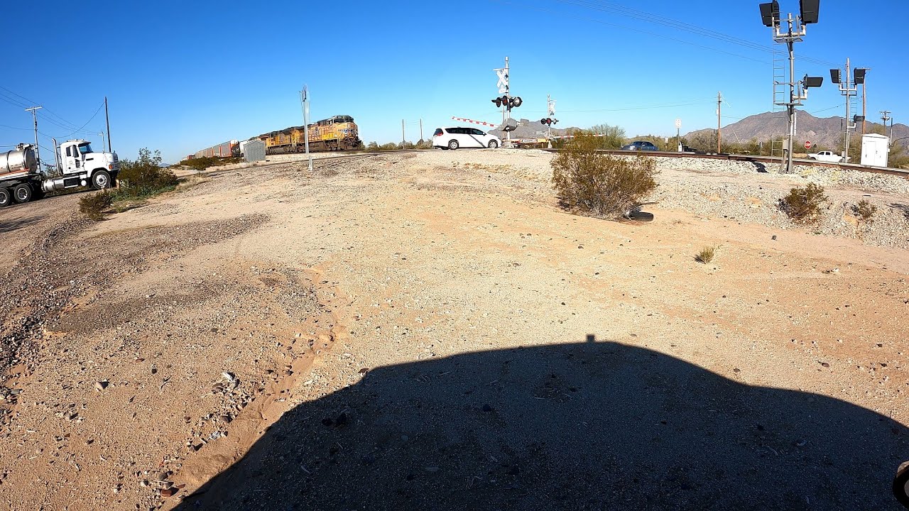 Minivan under Railroad Crossing Arm, Train approaching Rio Bravo Rd ...
