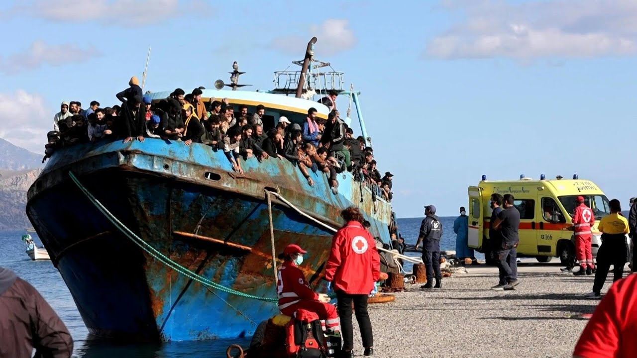 Boat carrying hundreds of migrants docks after Greek rescue | AFP - YouTube