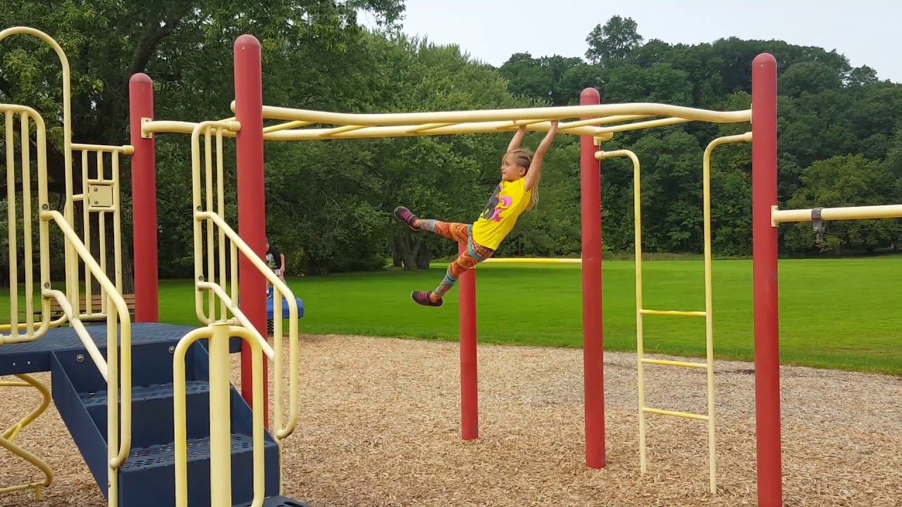 Having fun on the monkey bars - YouTube