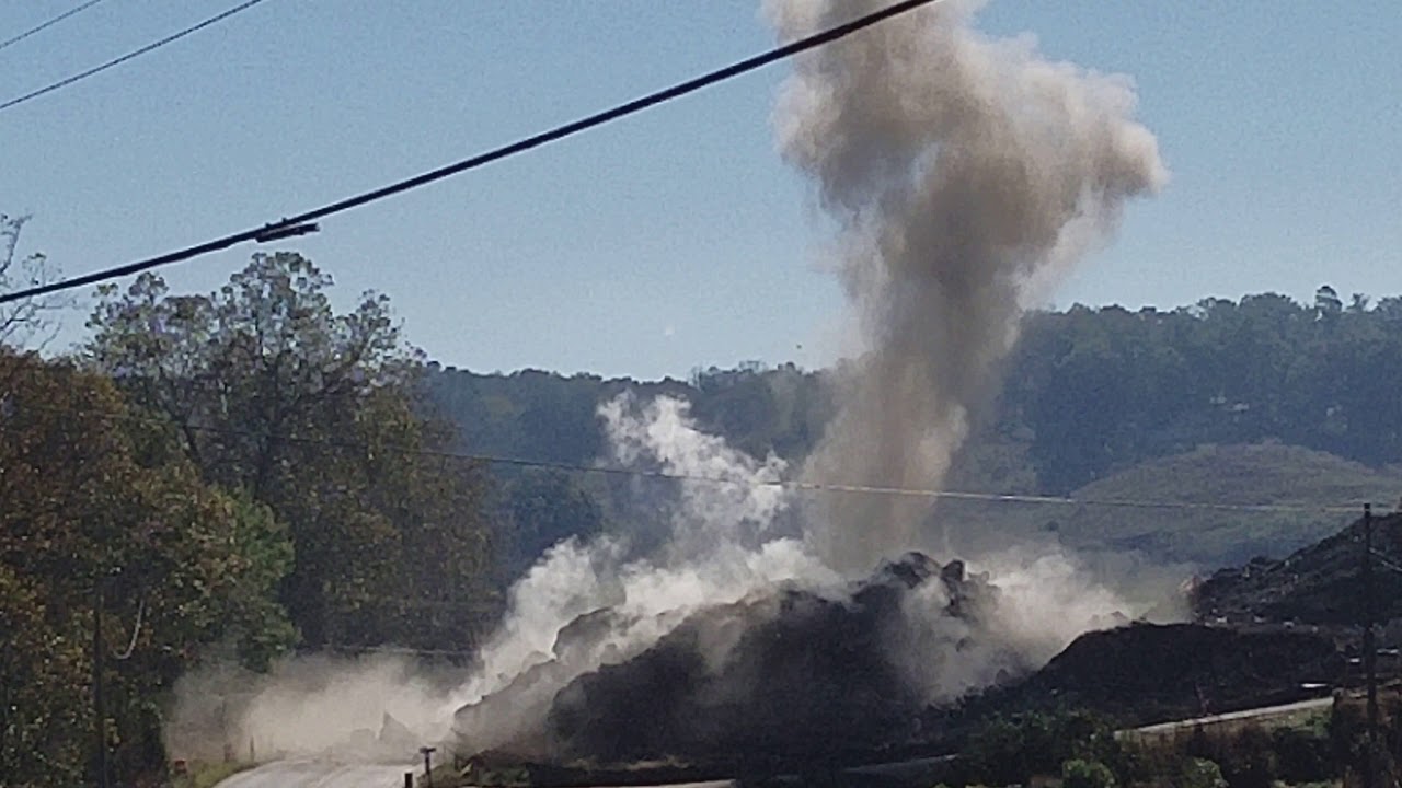 Explosion with boulders flying & landslide blocks Leicester highway ...