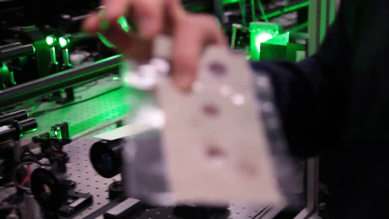 Laser impact on photo sensitive paper - YouTube