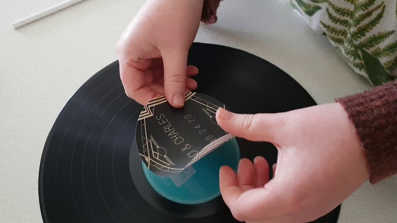 How to attach a label to vinyl record and create a hole - YouTube