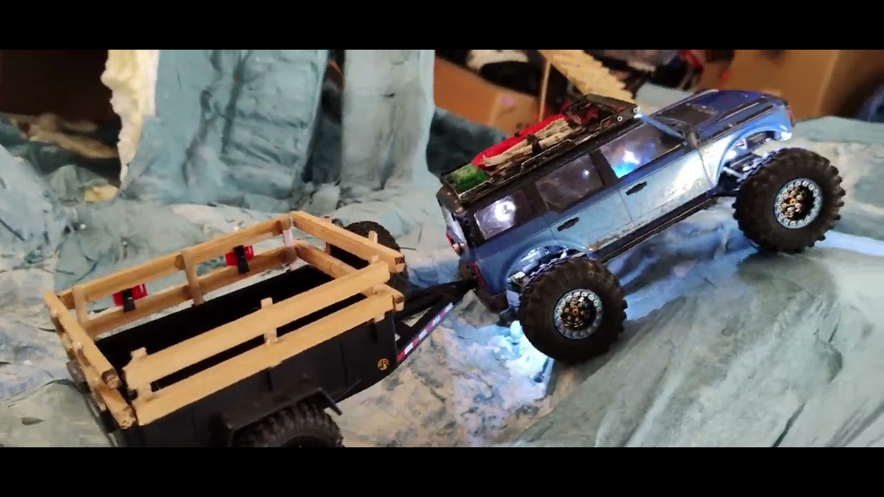 scx24 bronco with Traxxas trx4M trailer on the indoor crawler course ...