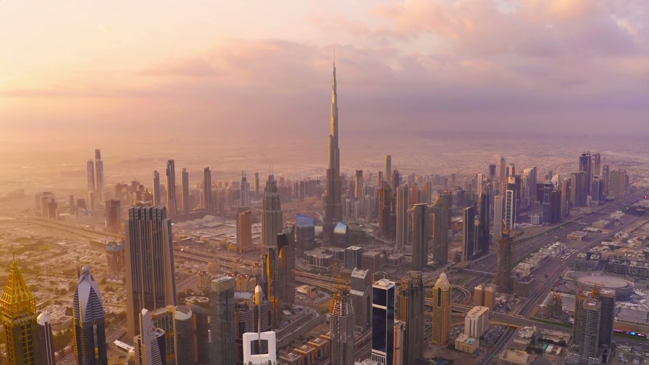 4K Aerial view of Burj Khalifa in Dubai Downtown skyline and highway ...