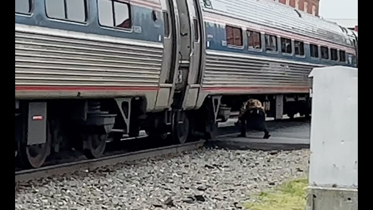 Man goes under train - YouTube