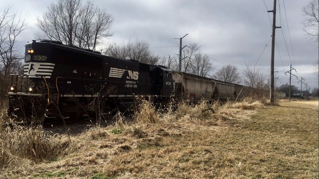 Close-up of long hood forward Norfolk Southern mixed freight train ...