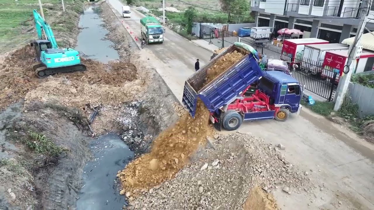 This video shows the construction of a road and the dump truck falling ...
