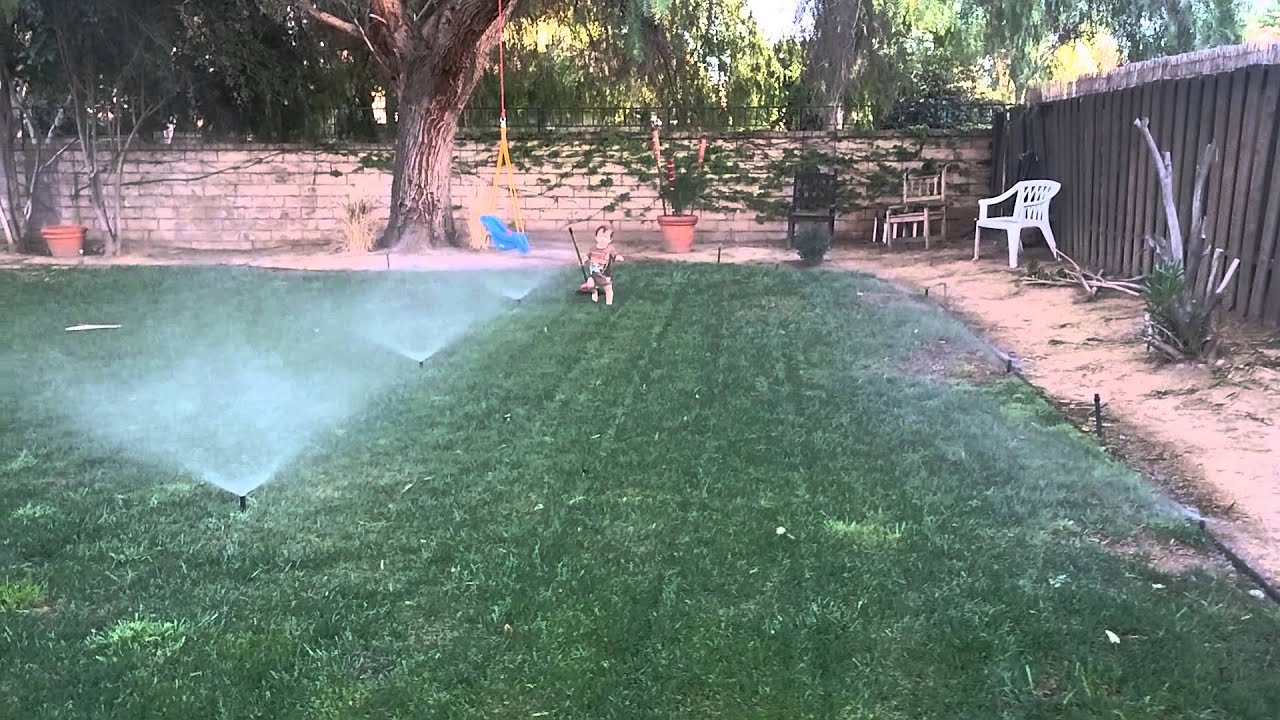 Blake running through sprinklers 3-20-14 - YouTube