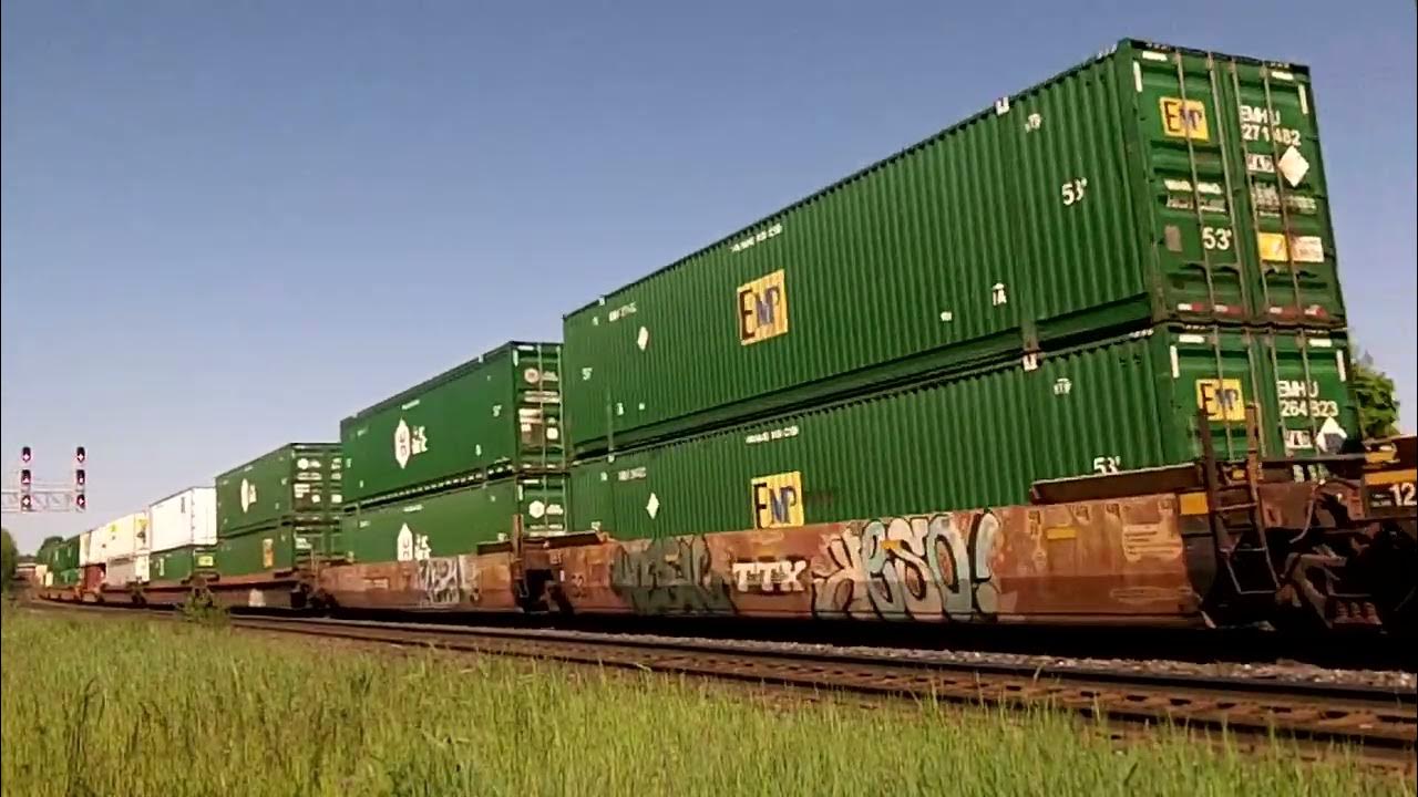 CN 148 w/ CN Engines 8805 & 2535 lead this 332 axle, EB Intermodal/Autorack train by Georgetown ...