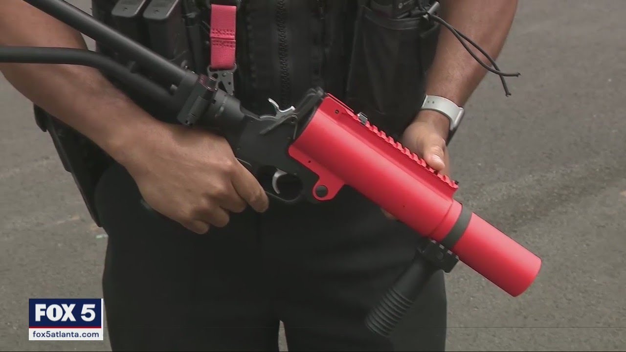 Conyers police roll out less lethal weapons - YouTube