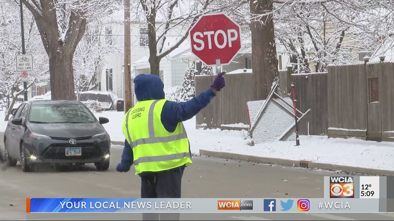 Crossing guards brave frigid cold - YouTube