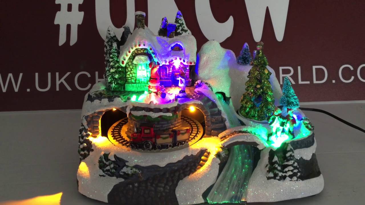 Animated Christmas Village Scene with Rotating Christmas Tree - YouTube