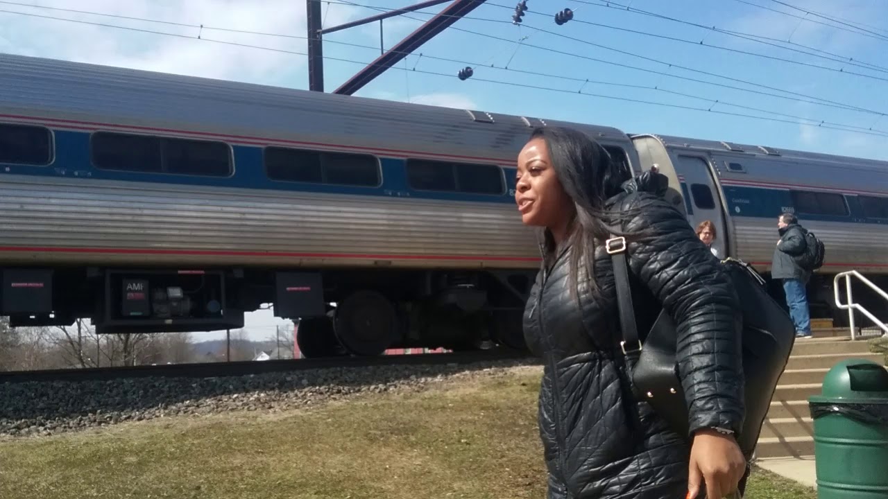 Amtrak train stopping at the station to pick up passengers to get to ...