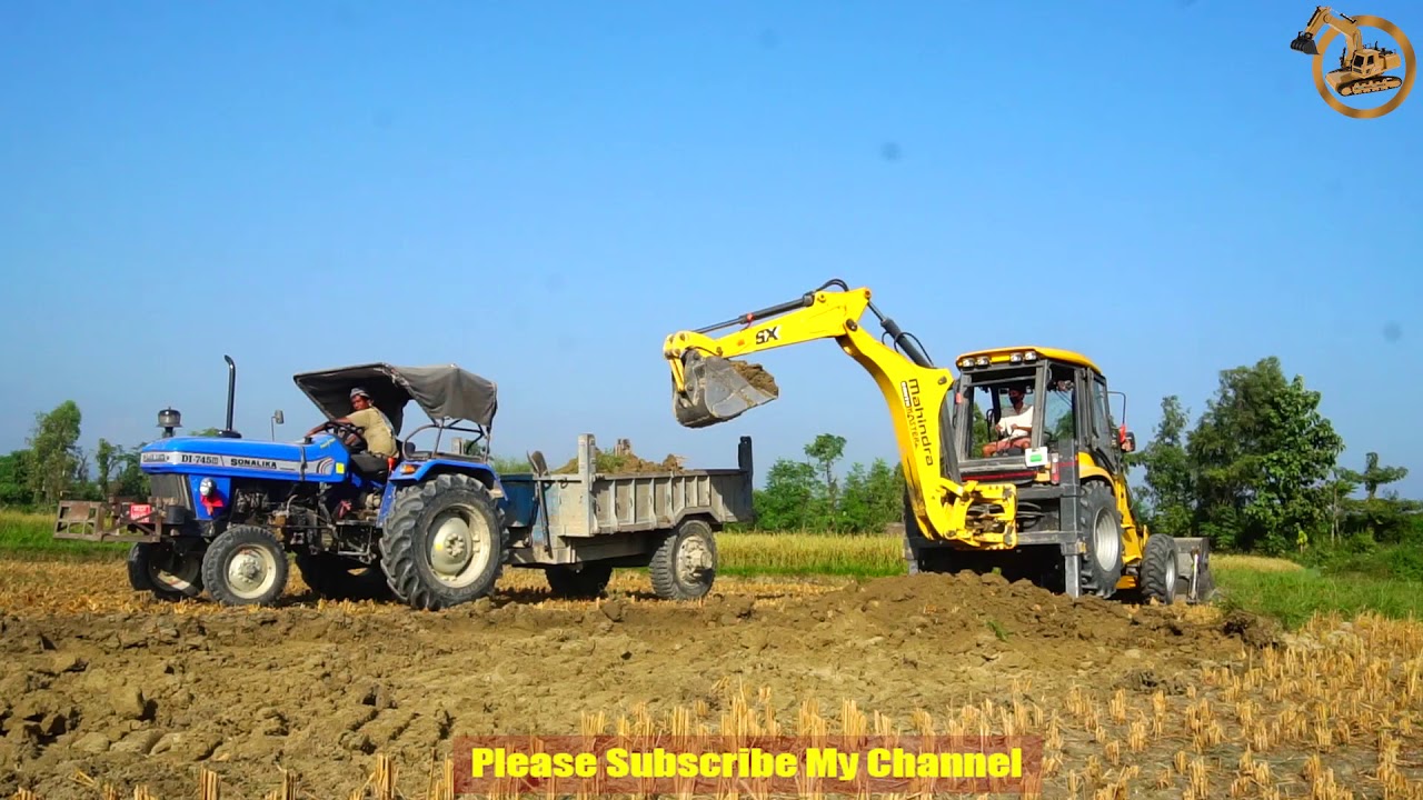 MAHINDRA EARTHMASTER BACKHOE LOADER WORKIN ON SANDY PLACE LOADING SOIL ...