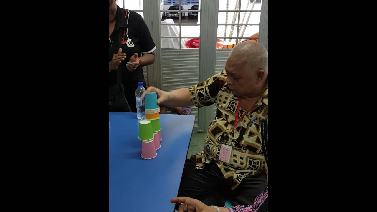 Elderly doing cup stacking - YouTube